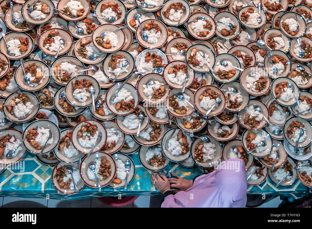 Plates of food of Indonesian Muslims gathered for iftar (fast-breaking ...