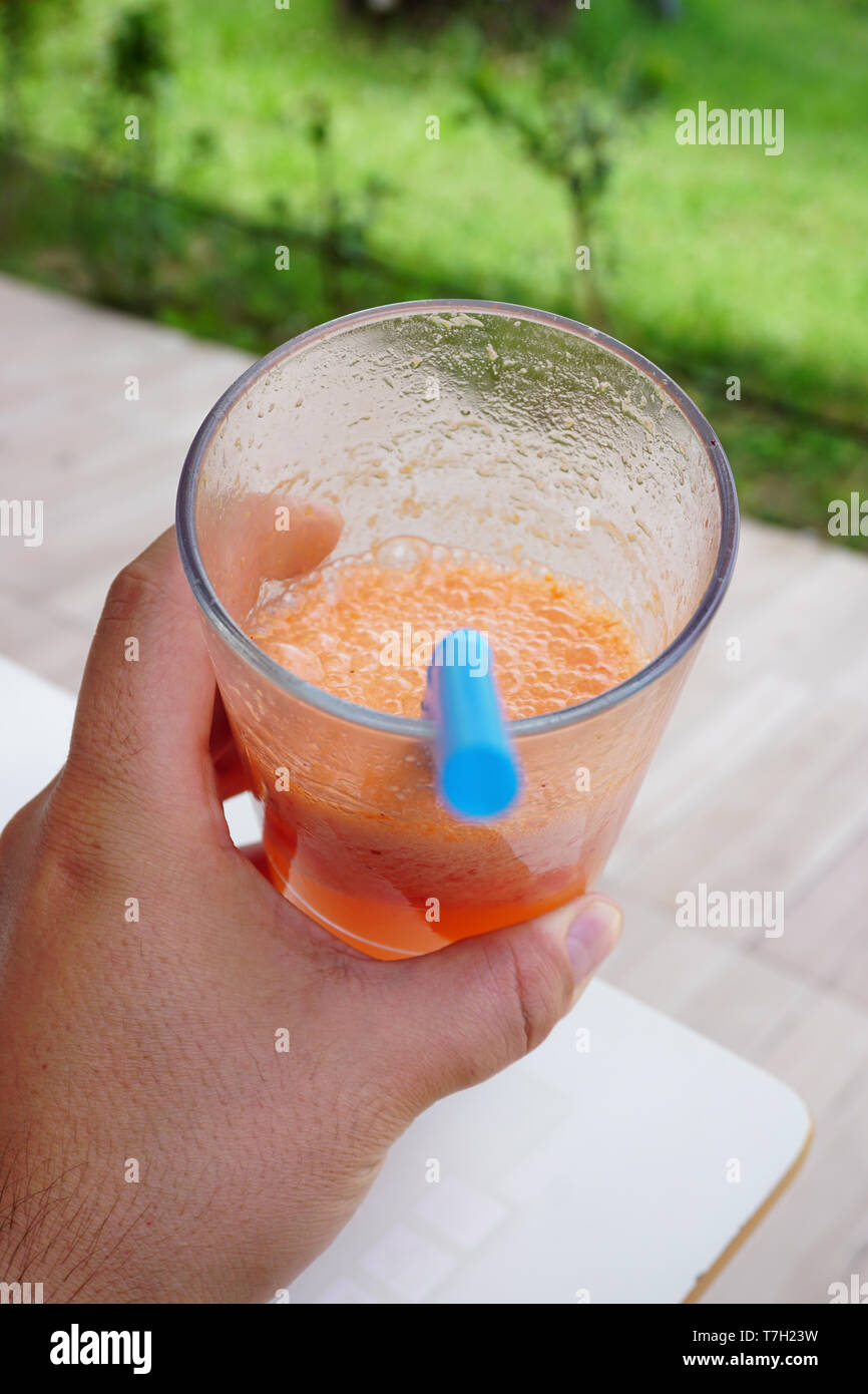 Strawberry lemonade in hand Stock Photo - Alamy