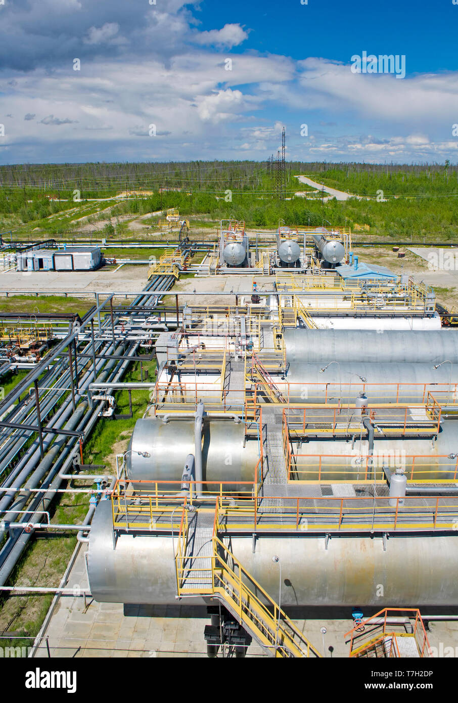 White oil reservoir. Oil and gas refinery plant. Industrial scene of ...