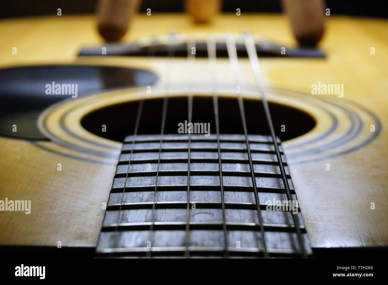 Playing guitar hands on the strings close up view Stock Photo - Alamy