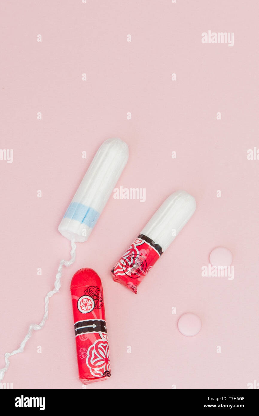 Menstrual period concept. Woman hygiene protection. Cotton tampons on ...