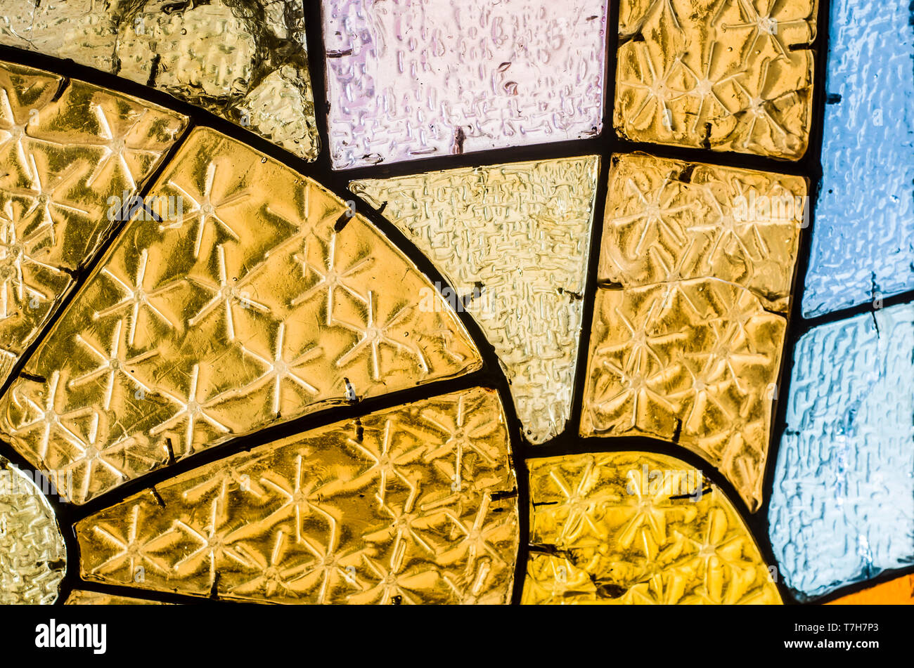 Rectangular and round stained glass window with red rose. Abstract ...