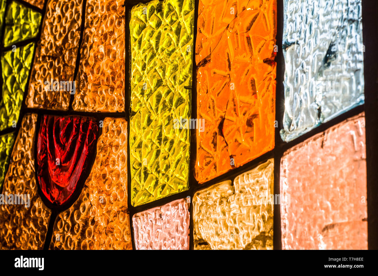 Rectangular and round stained glass window with red rose. Abstract ...