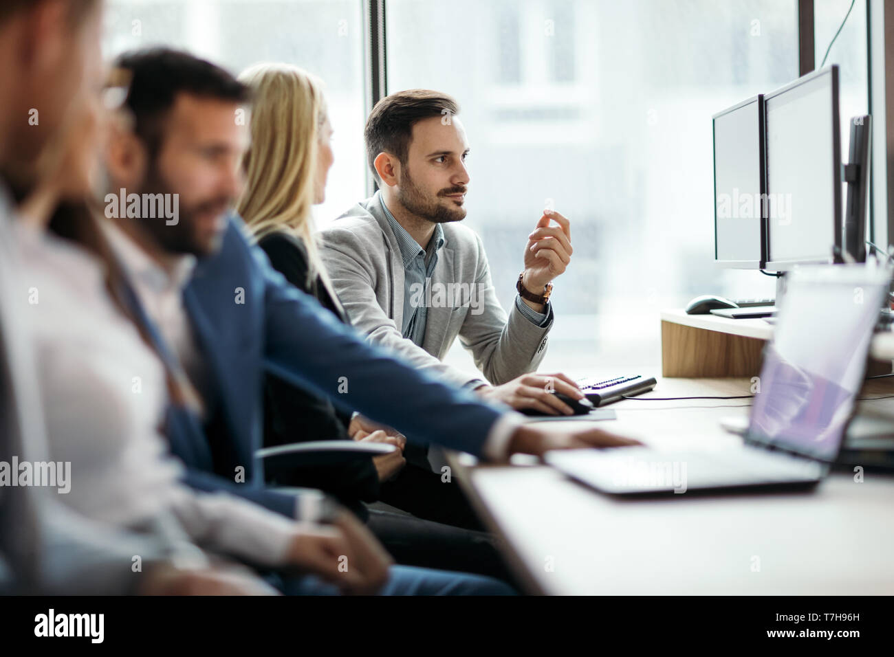 Picture of business people working together in office Stock Photo - Alamy