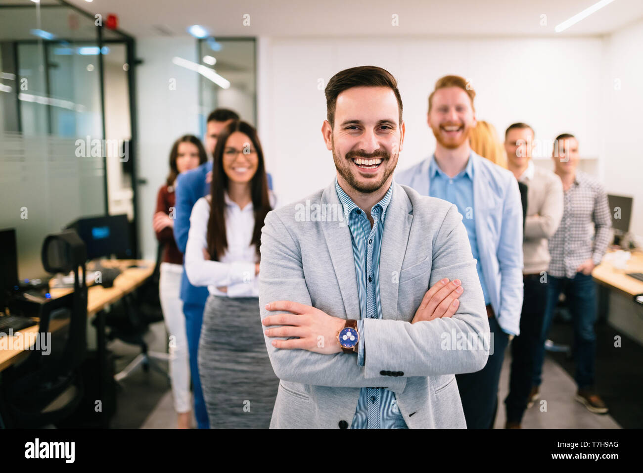 Business team posing happy manager hi-res stock photography and images ...