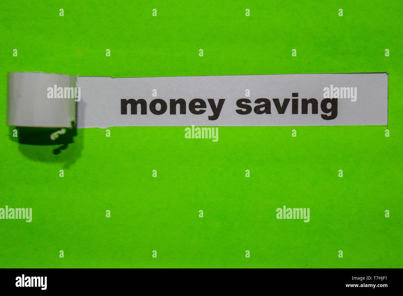 Money Saving, Inspiration and business concept on green torn paper ...