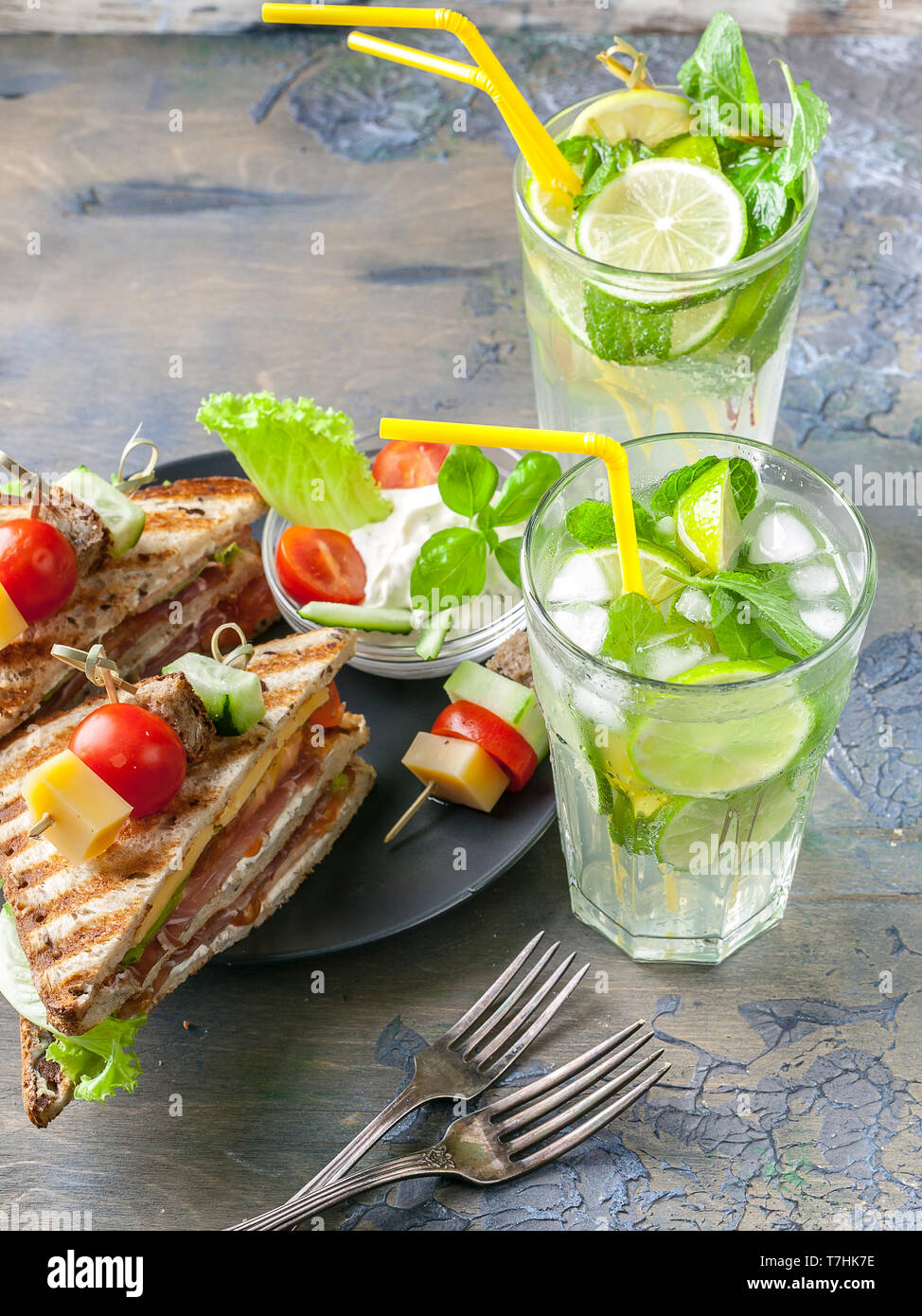 Delicious sandwiches and homemade lemonade. Drinks and snacks. Vertical ...
