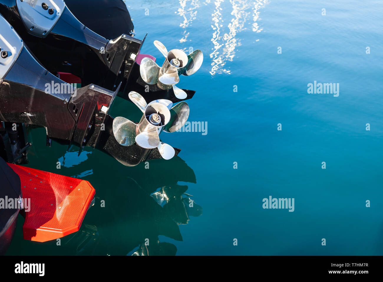 Two motor boat screws on sea water background. Horizontal day shot ...