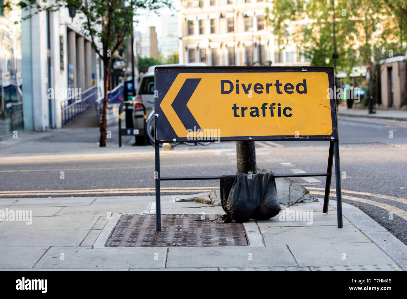 Yellow diverted traffic road sign in a UK city street Stock Photo - Alamy