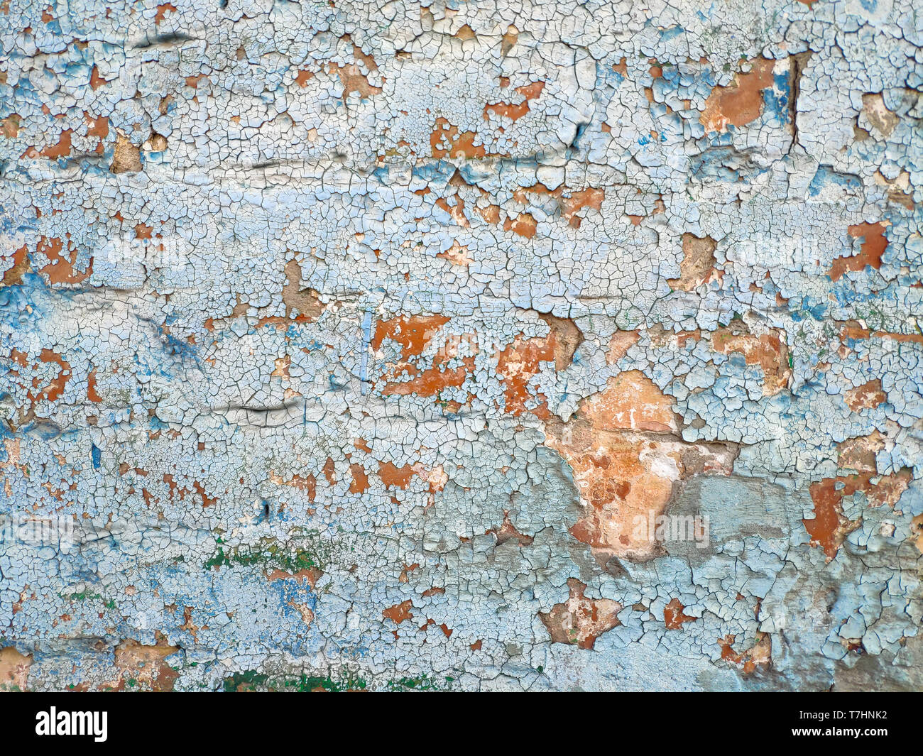Concrete wall cracked paint, paint abstractly behind the concrete ...