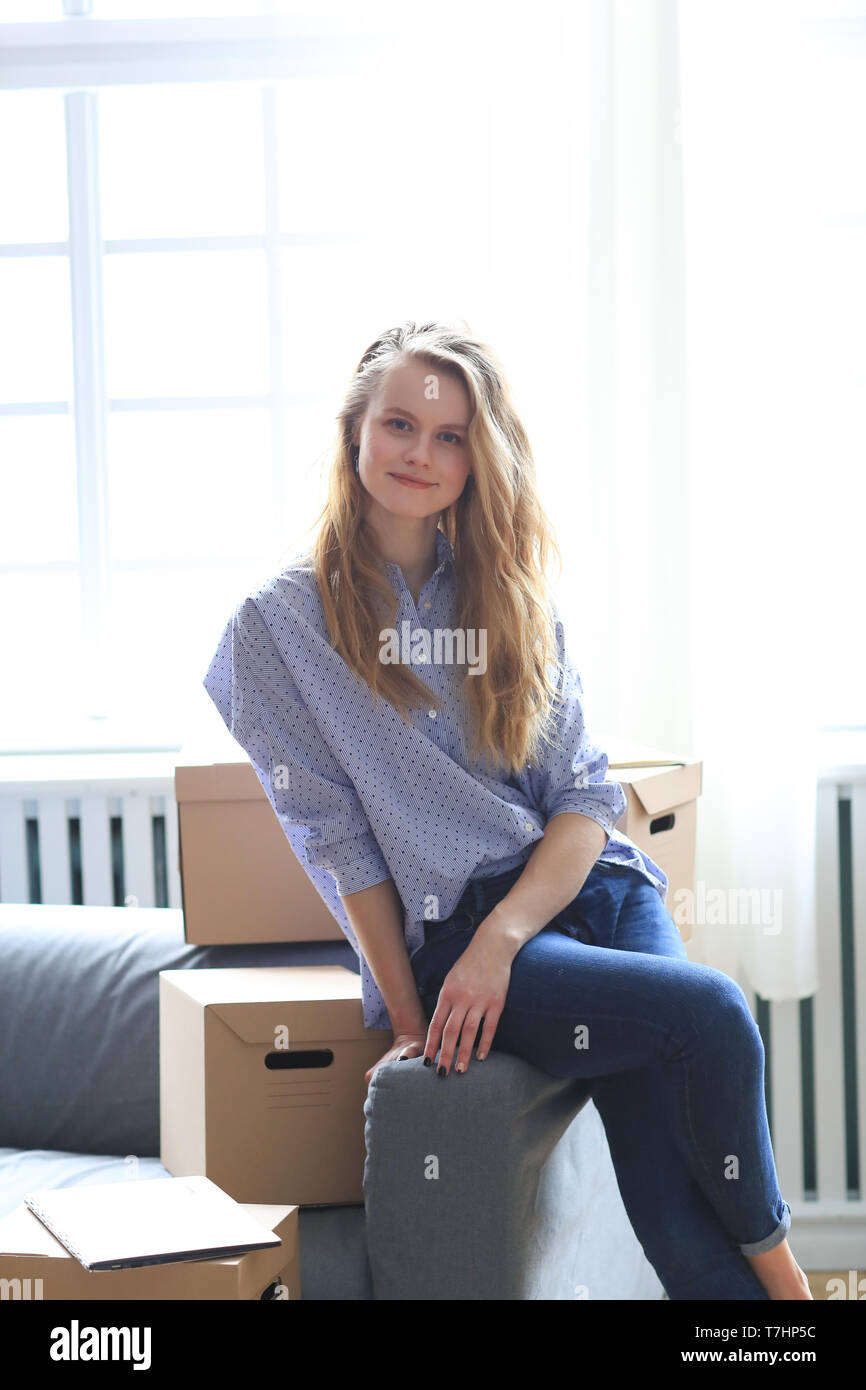 Girl is moving to new home Stock Photo - Alamy