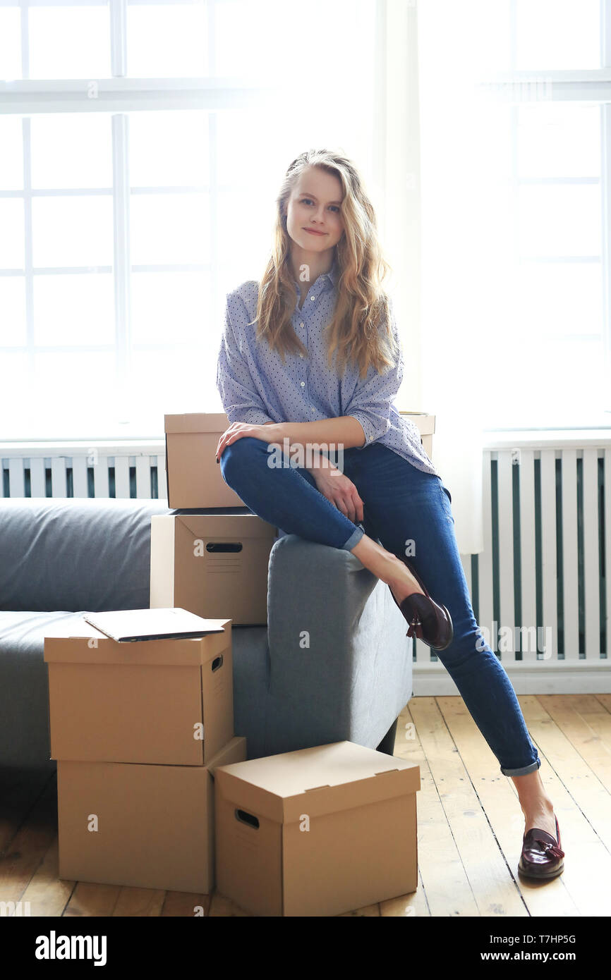 Girl is moving to new home Stock Photo - Alamy