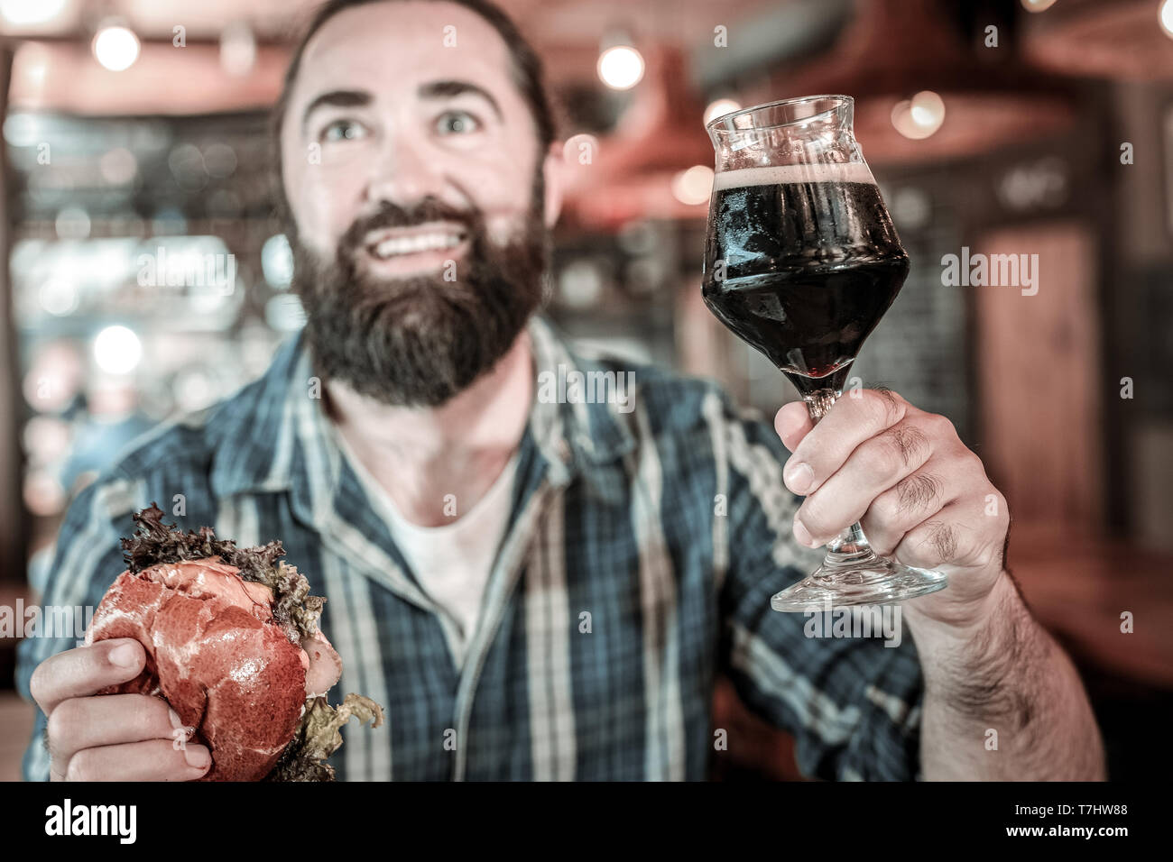 Man eating hamburger drinking beer hi-res stock photography and images ...