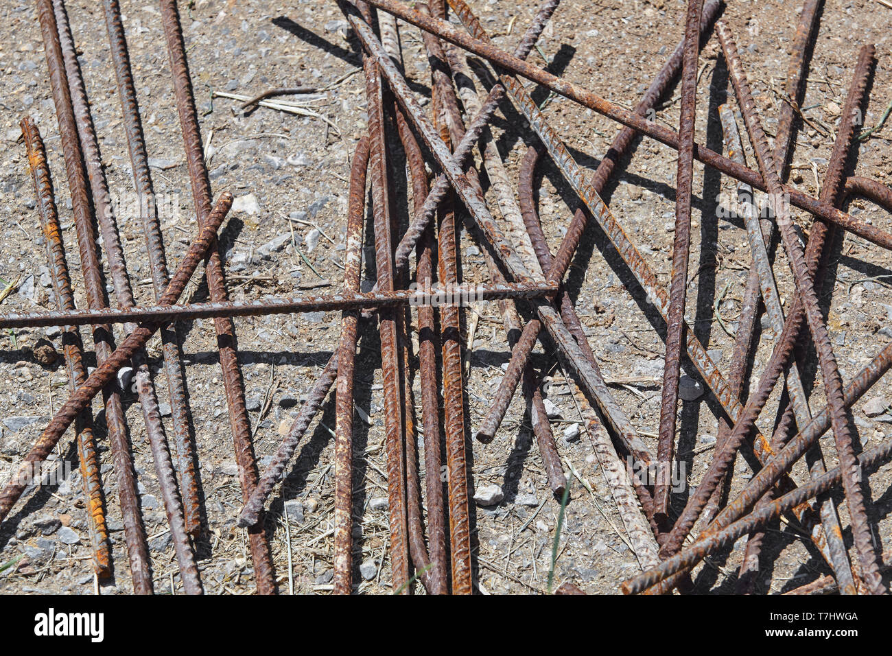 Construction iron bars on concrete background Stock Photo - Alamy