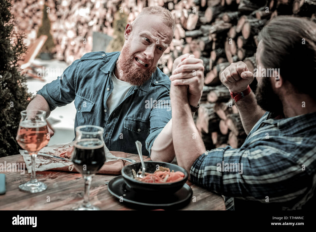 Two mature men squaring off in arm-wrestling Stock Photo - Alamy