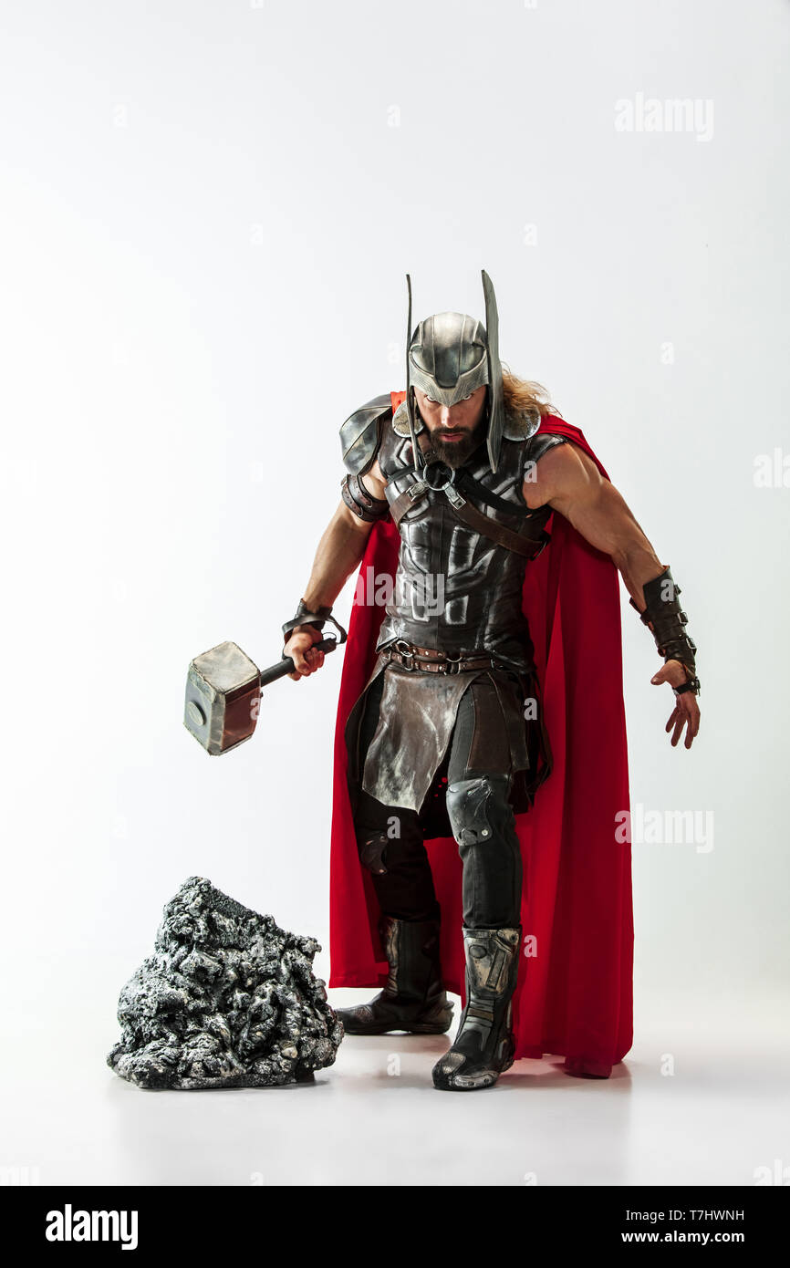 Long hair and muscular male model in leather viking's costume with the ...