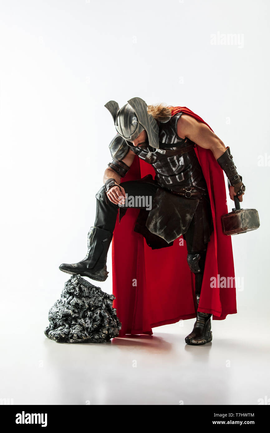 Long hair and muscular male model in leather viking's costume with the ...