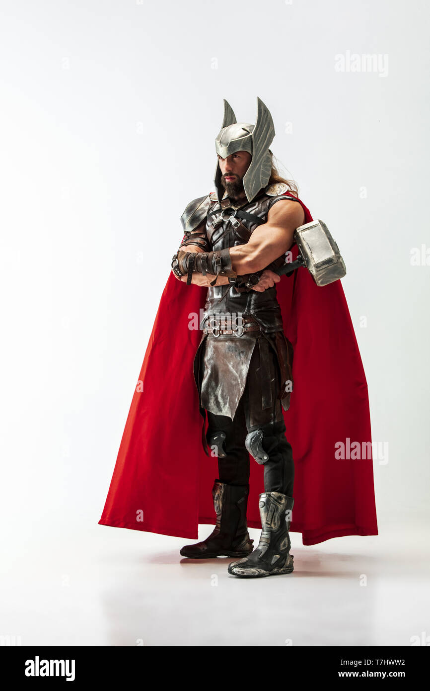 Long hair and muscular male model in leather viking's costume with the ...