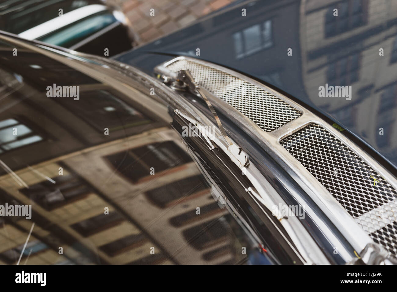 The reflection of the windows of the houses of the old city windscreen ...