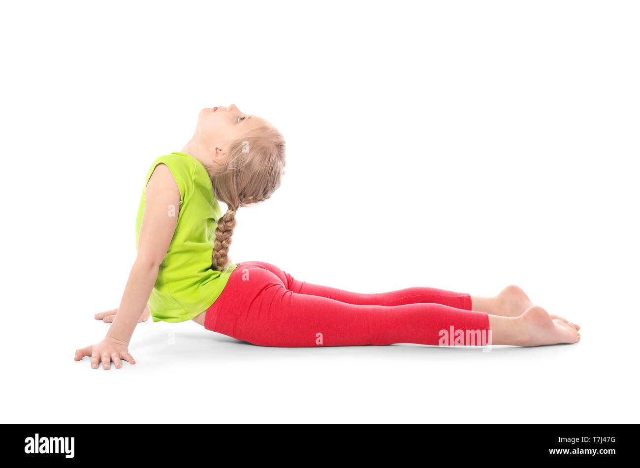 Little girl practicing yoga on white background Stock Photo - Alamy