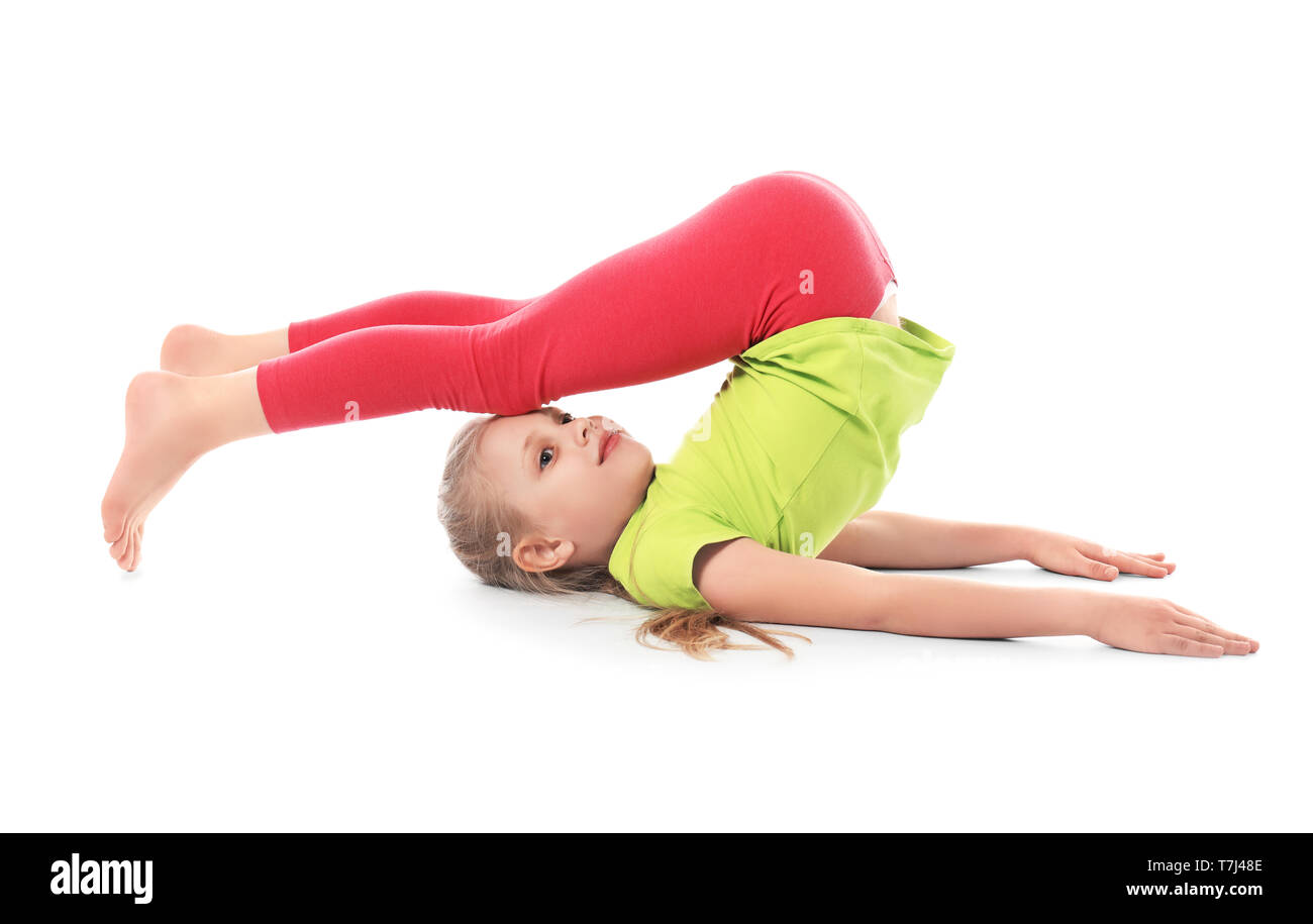 Little girl practicing yoga on white background Stock Photo - Alamy