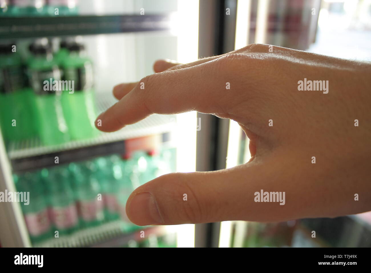 Hand grabbing a bottle hi-res stock photography and images - Alamy