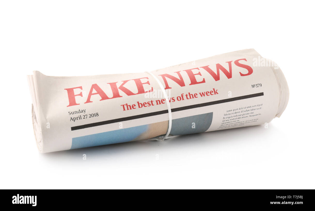 Rolled newspapers on white background Stock Photo - Alamy