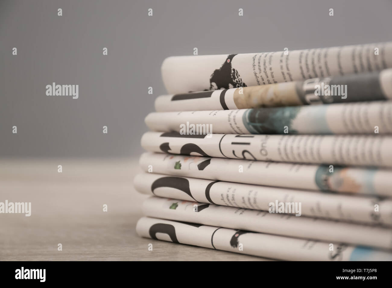 Pile of various newspapers on table Stock Photo - Alamy