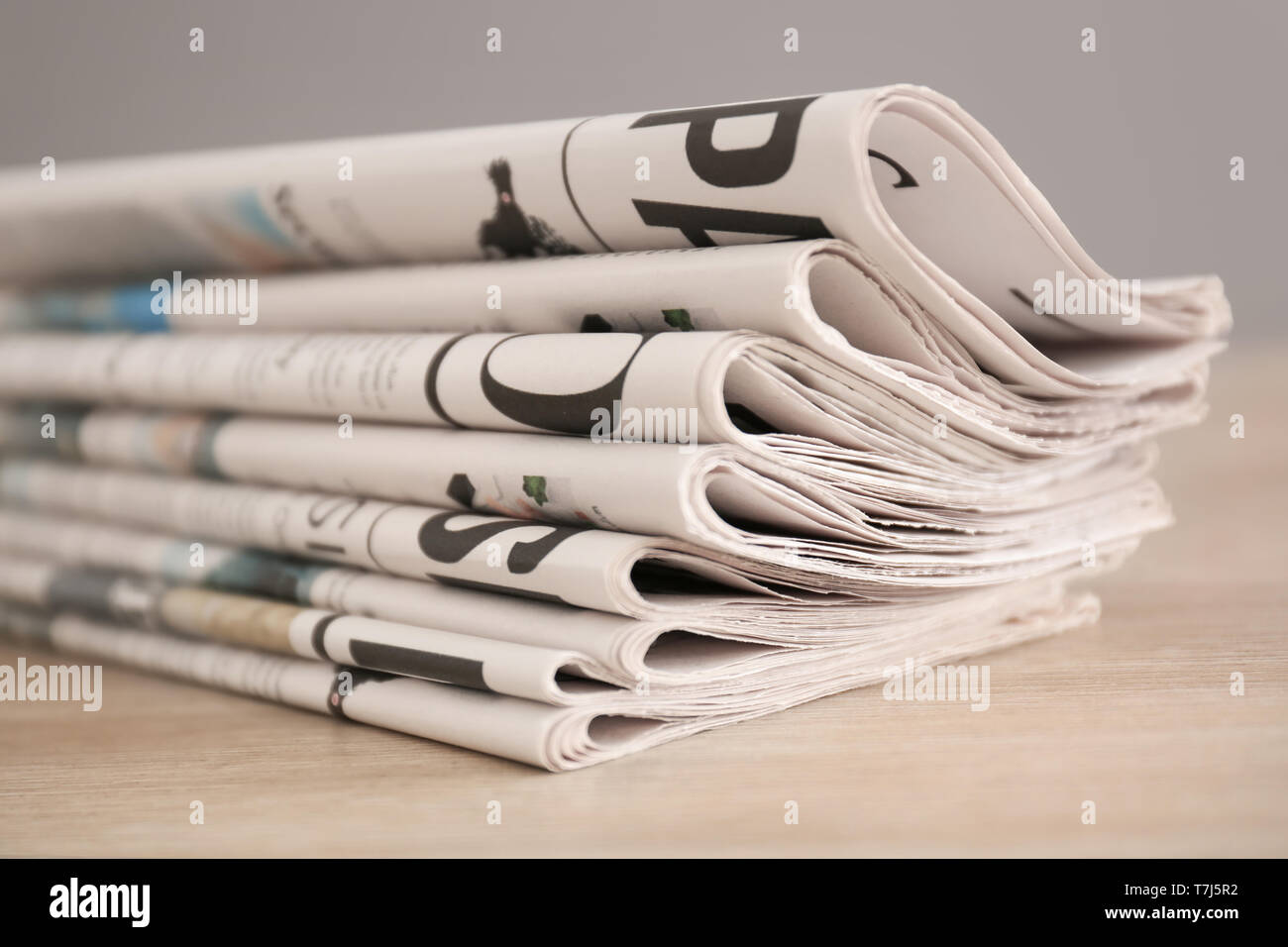 Pile of various newspapers on table Stock Photo - Alamy