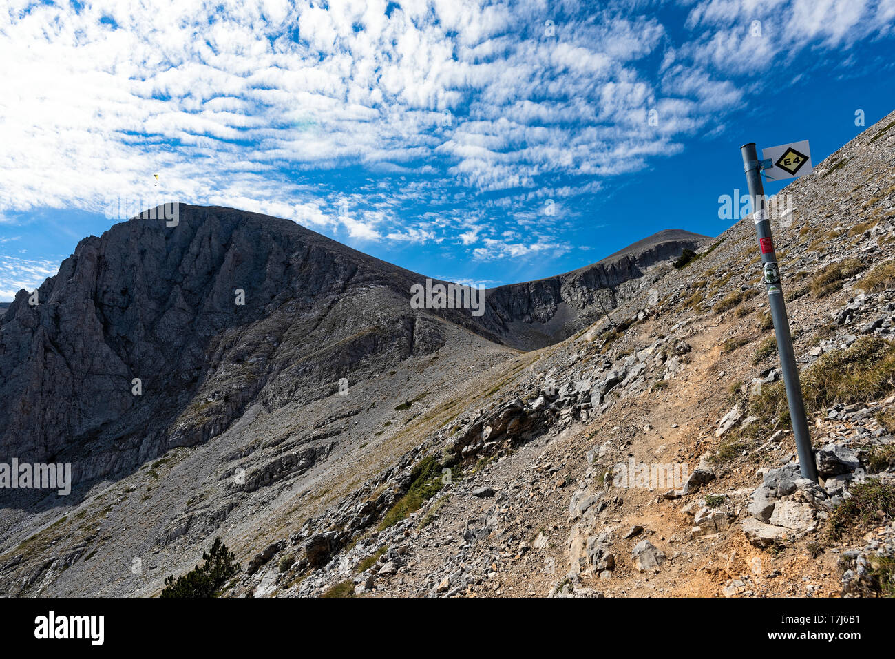 View of the peak named Skolio and sign post of the E4 european long ...
