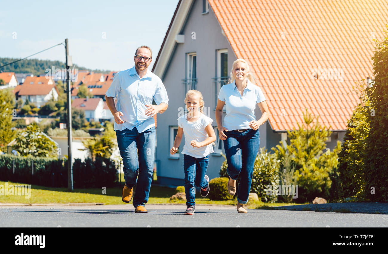 Happy family running hi-res stock photography and images - Alamy