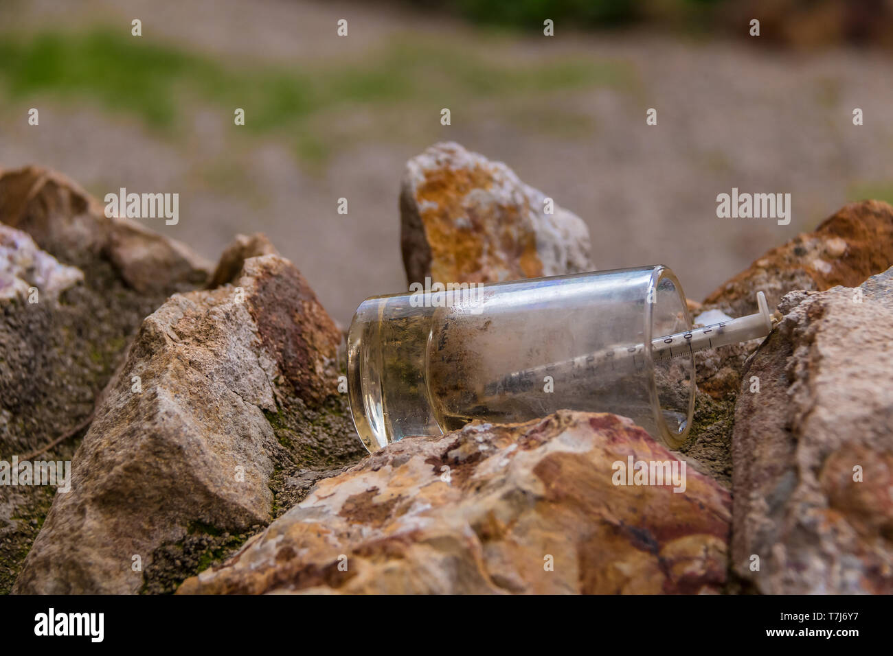 Dirty syringe in glass hi-res stock photography and images - Alamy