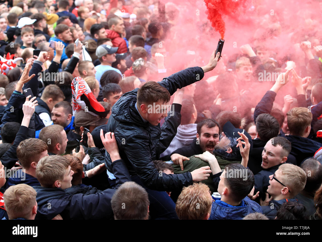 Fans light flares during the promotion parade in Sheffield City Centre ...