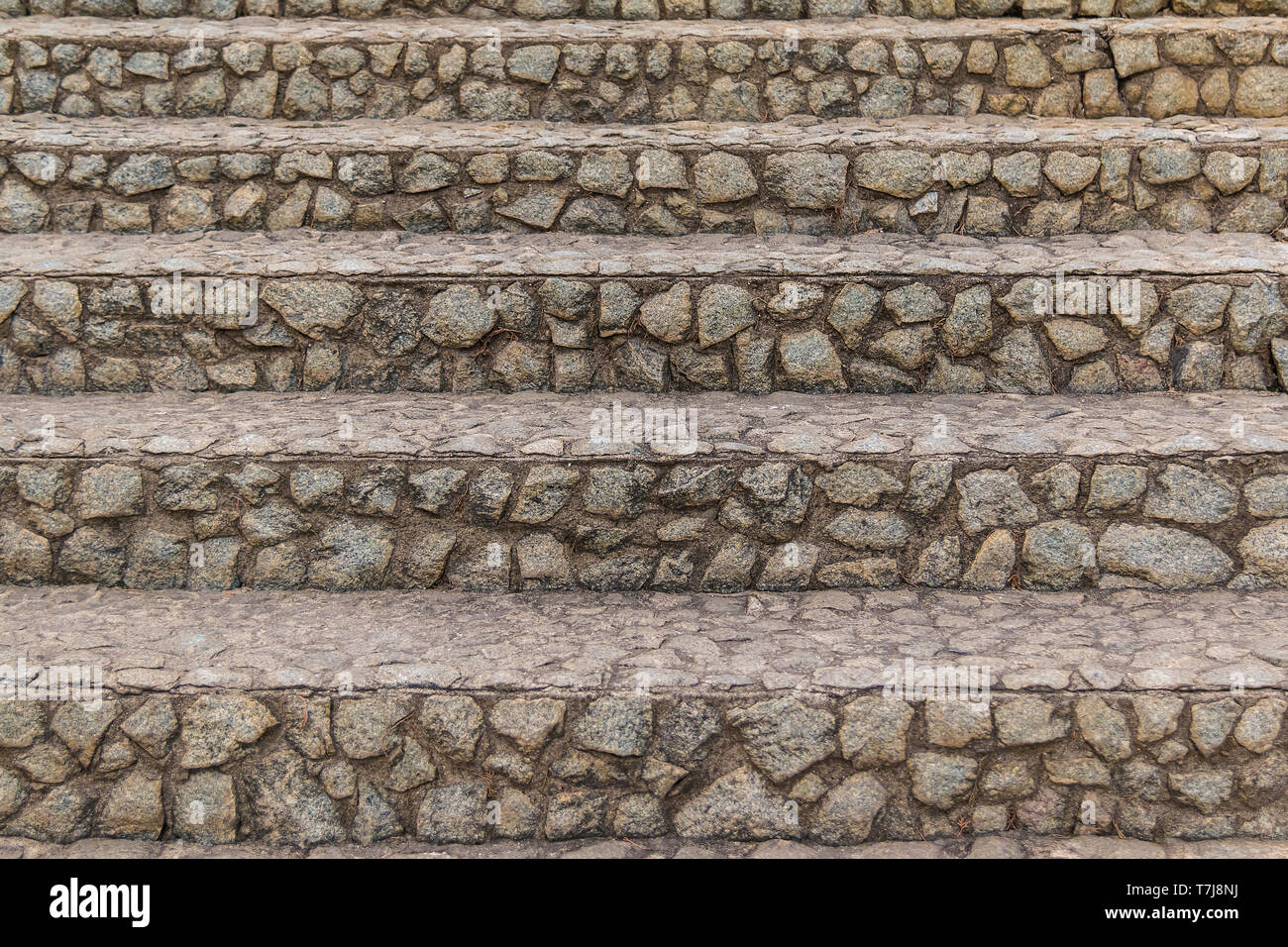 A rough stone stairs on the Montjuic Cemetery front view closeup ...