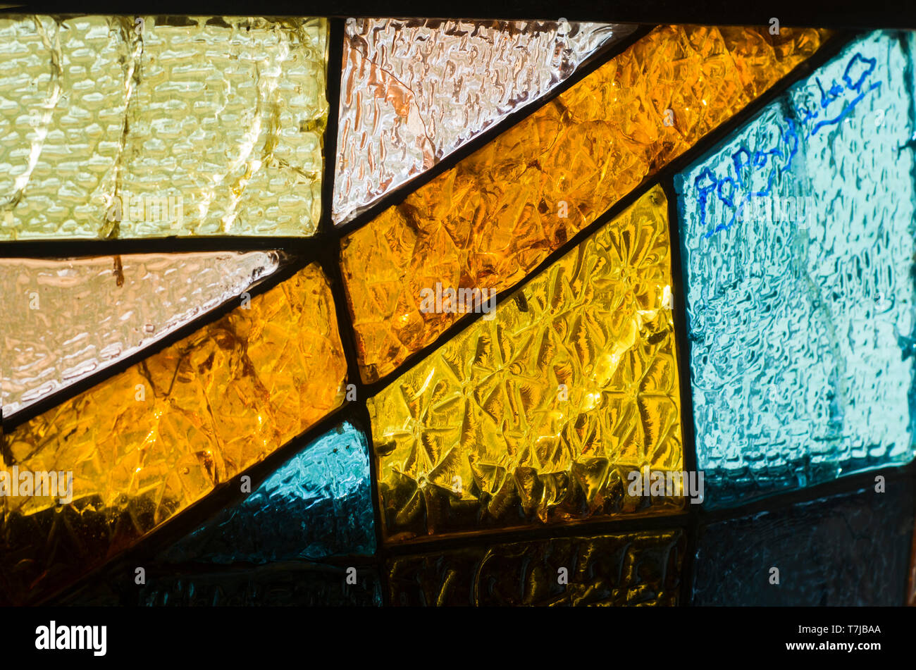 Rectangular and round stained glass window with red rose. Abstract ...