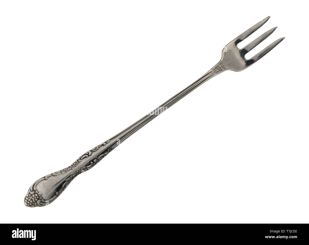 Top view of an antique fruit fork isolated on a white background Stock ...