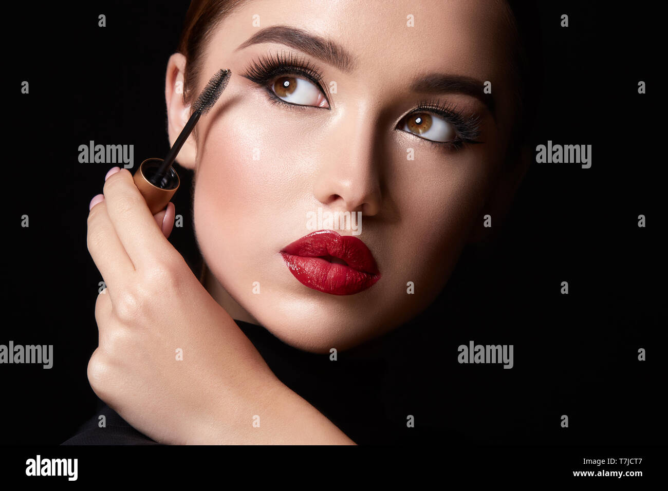 Make up model at black background Stock Photo - Alamy