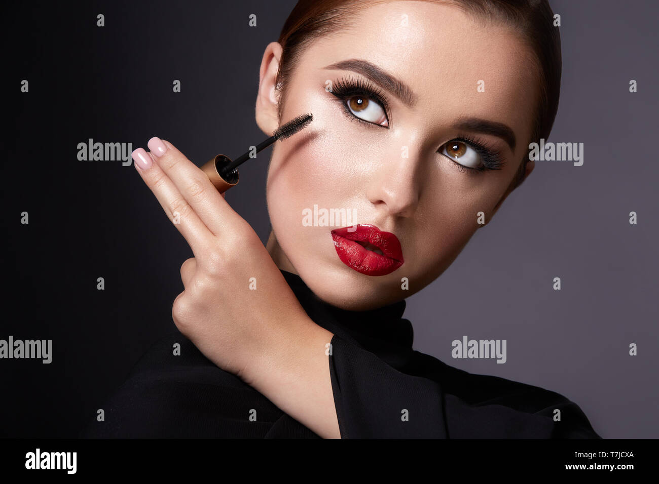 Make up model at black background Stock Photo - Alamy