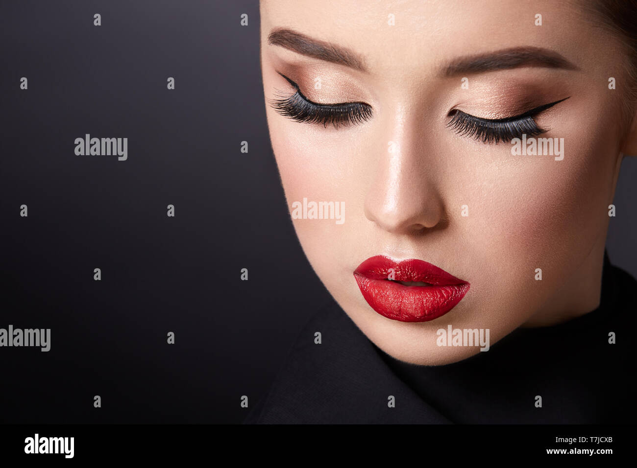Make up model at black background Stock Photo - Alamy