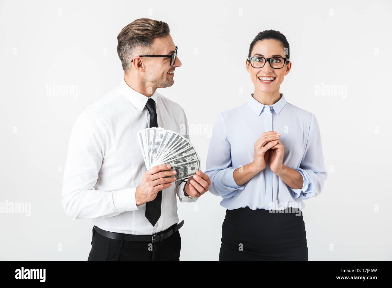 Couple of colleagues wearing formal clothing standing isolated over ...