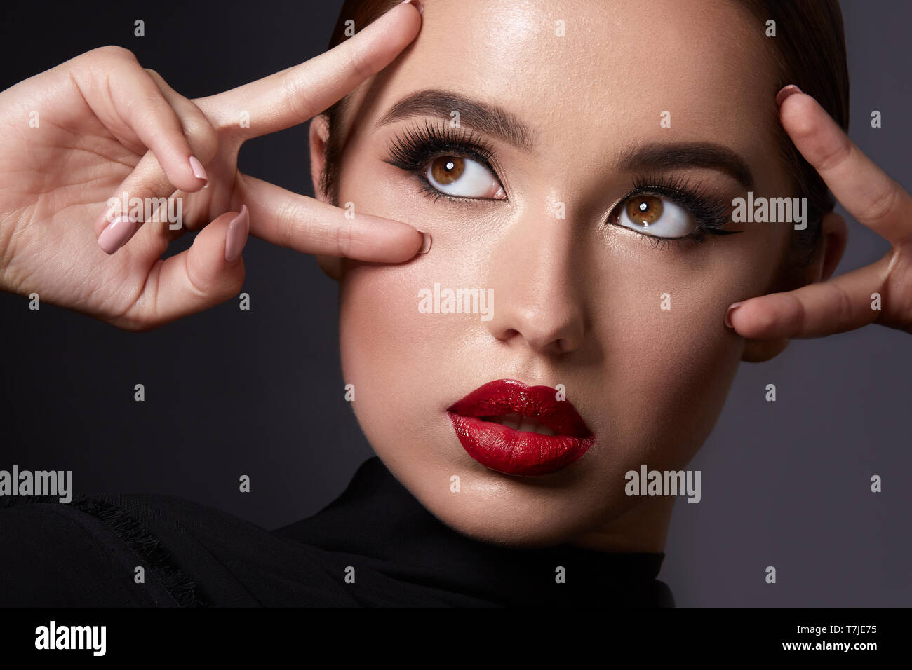 Make up model at black background Stock Photo - Alamy