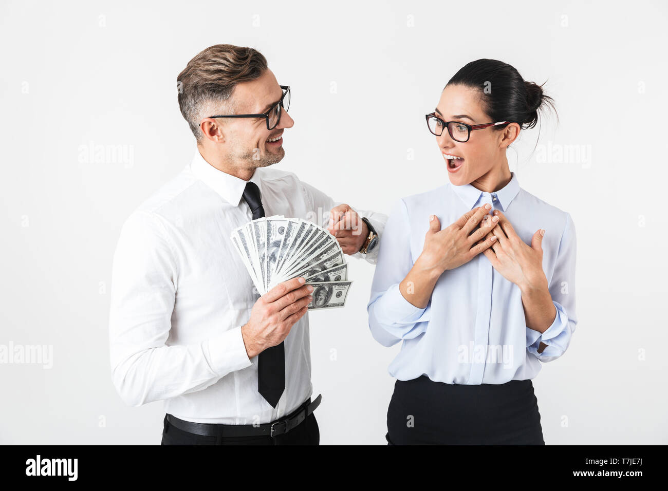 Couple of colleagues wearing formal clothing standing isolated over ...