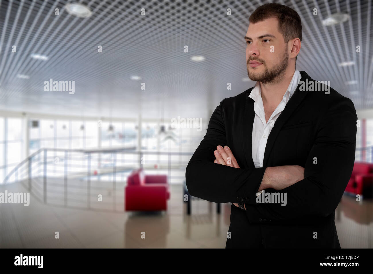 Beautiful serious business man on empty dealer center background Stock ...
