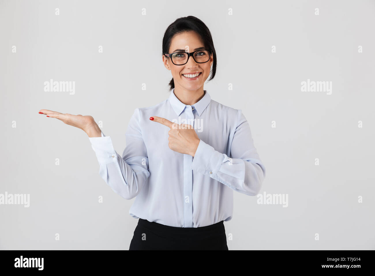 Photo of european businesswoman wearing eyeglasses standing in the ...