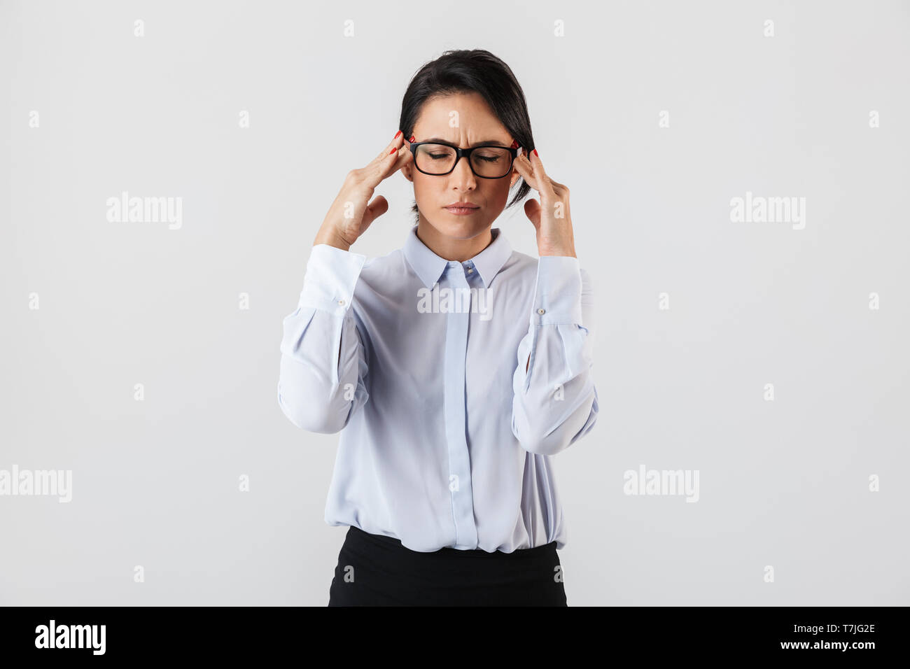Image of smart secretary woman wearing eyeglasses standing in the ...