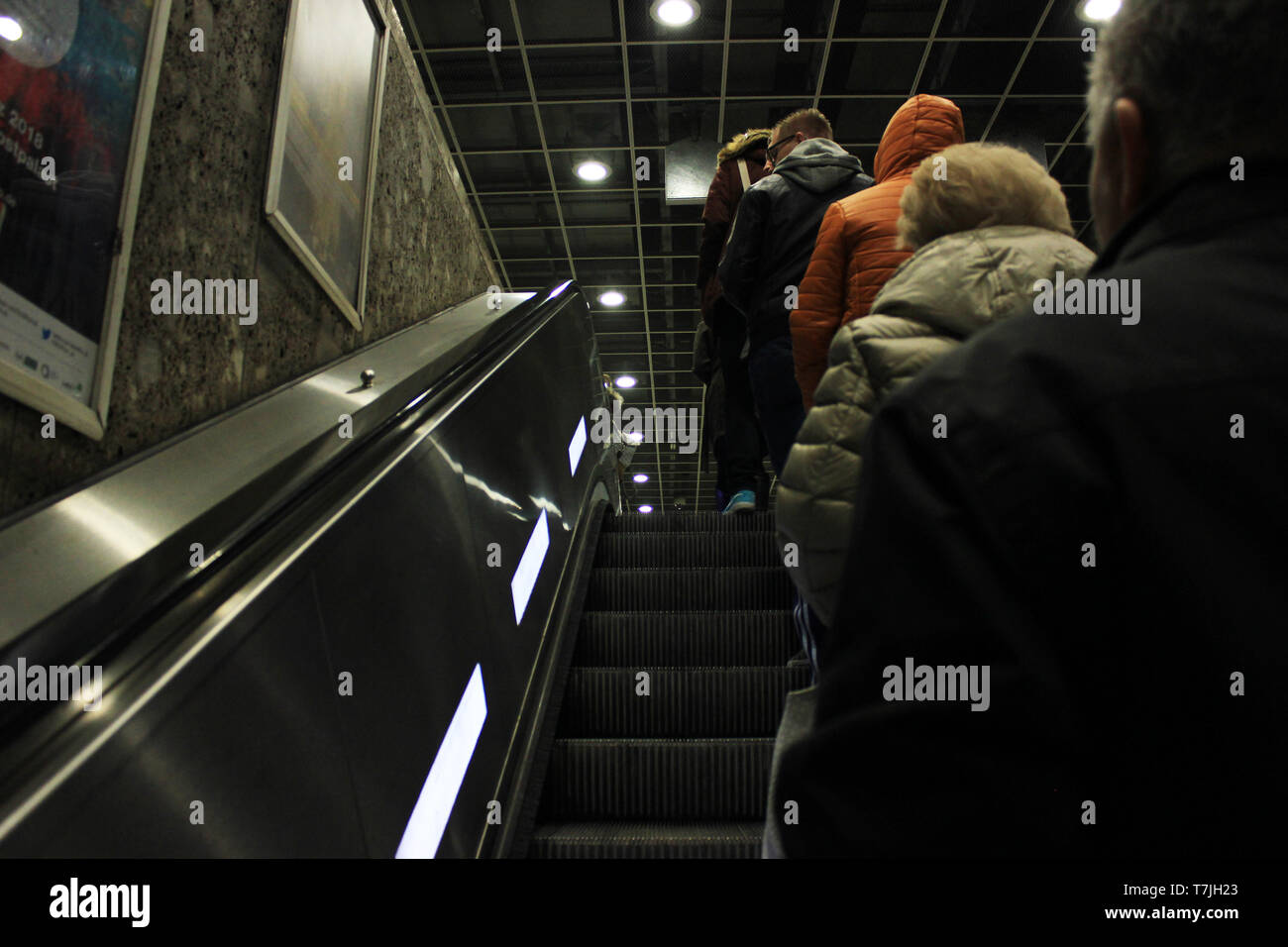 People lining up on moving staircase in the Underground Stock Photo - Alamy