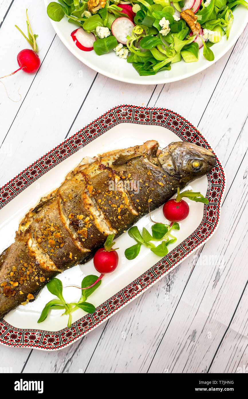 Roasted trout with vegetables walnuts and blue cheese - prepared Stock ...