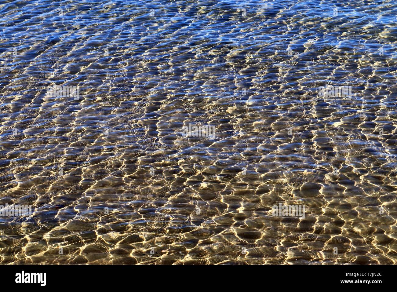 Close up surface of floating water with ripples and waves and some ...