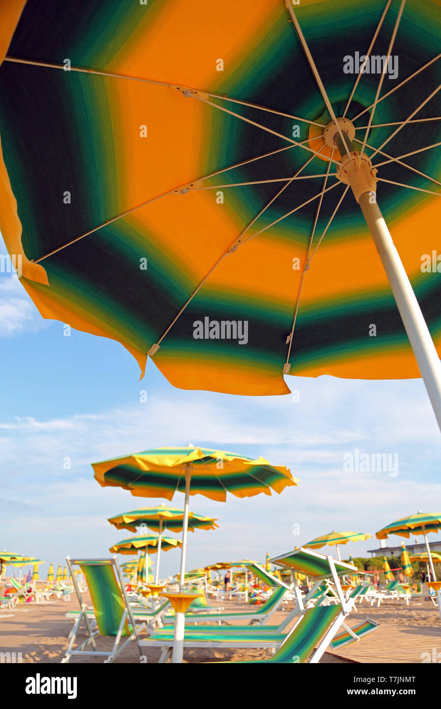 under a large parasol on the beach in summer without people Stock Photo ...