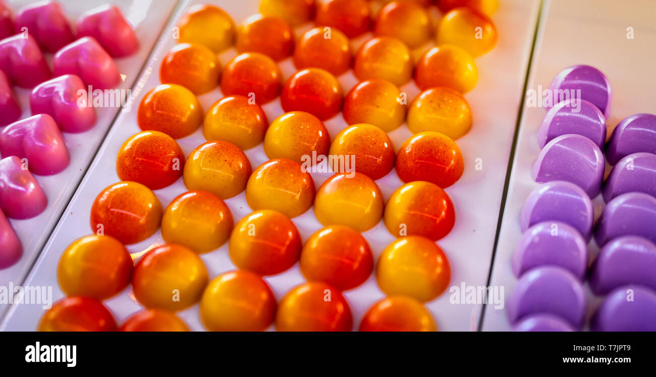 White chocolate shell with passion fruit ganache center and white ...